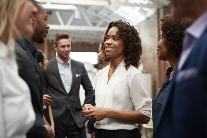 Business Team Standing Having Informal Meeting in Modern Office Stock ...