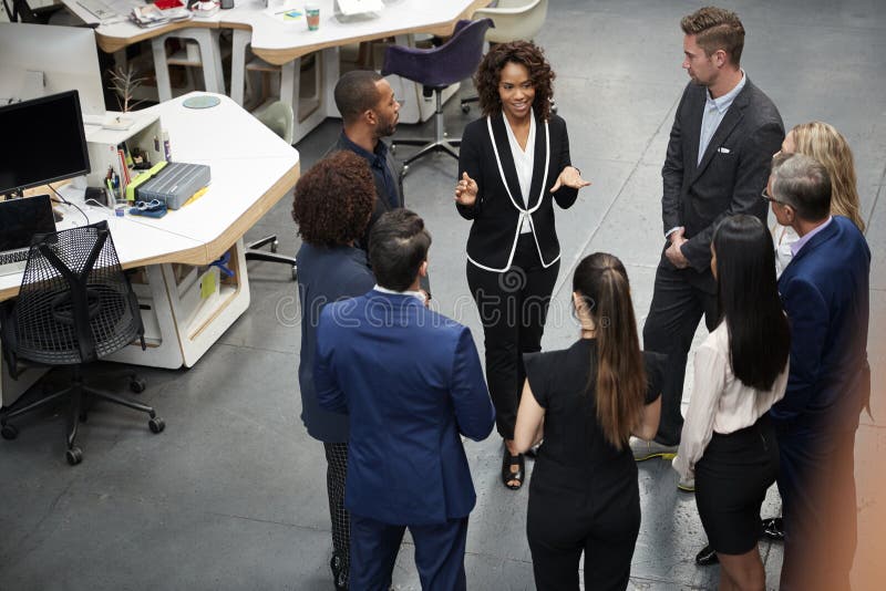 Business Team Standing Having Informal Meeting in Modern Office Stock ...