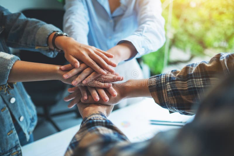 Business Team Standing and Joining Their Hands Together in Office Stock ...