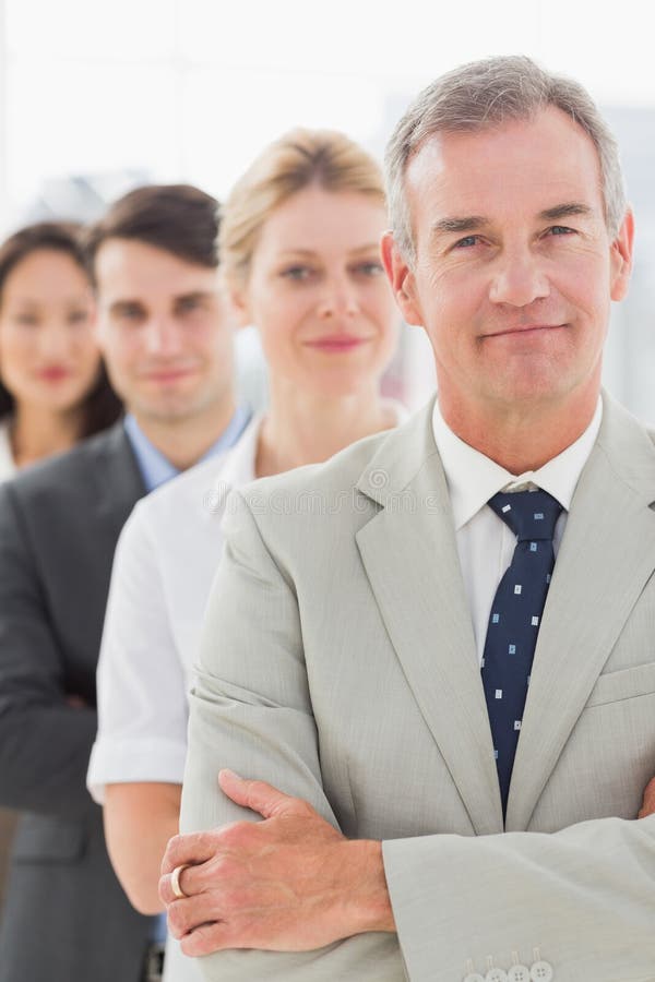 Business Team Standing in a Line Smiling at Camera Stock Photo - Image ...