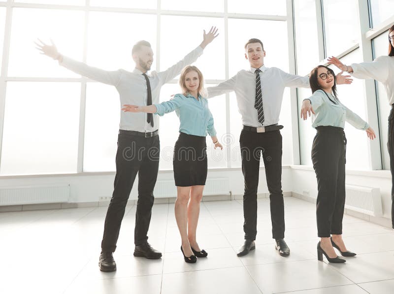 Business Team Standing in Spacious New Office. Stock Photo - Image of ...