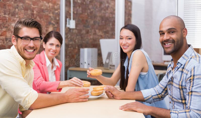 Business Team Taking Doughnut during Breaks Stock Image - Image of ...