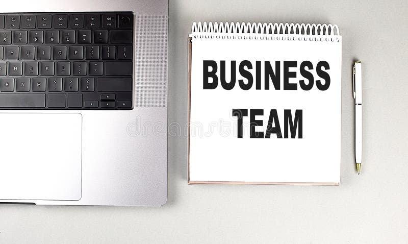 BUSINESS TEAM Text on Notebook with Laptop and Pen Stock Photo - Image ...