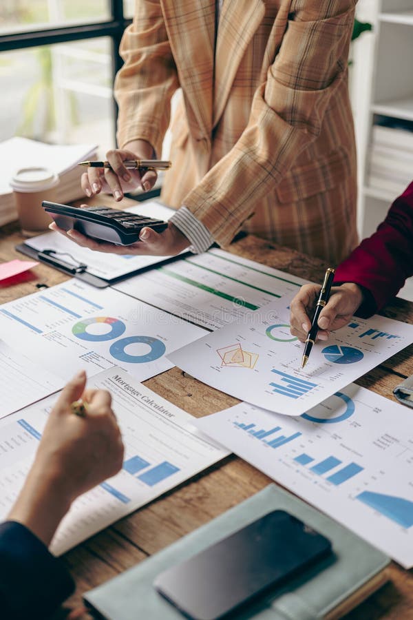 Business Team Two Managers Work on Accounting Documents and the Team ...