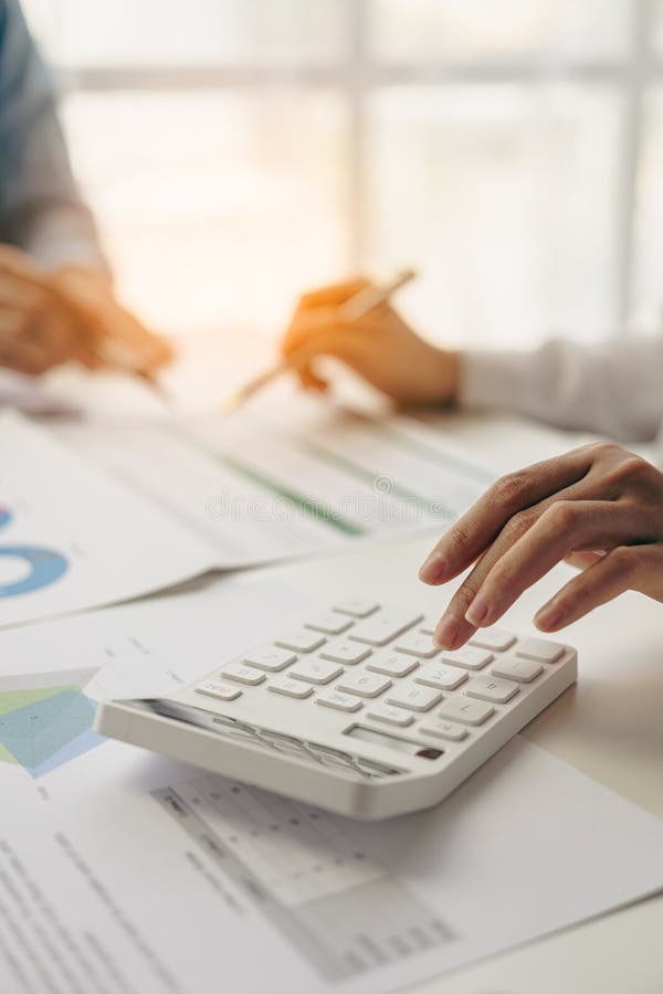 Business Team Two Managers Work on Accounting Documents and the Team ...