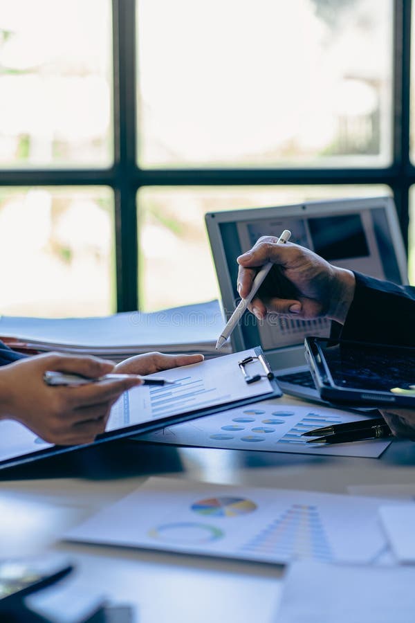 Business Team Two Managers Work on Accounting Documents and the Team ...