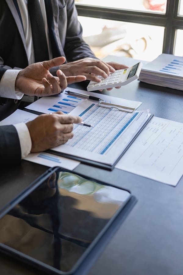 Business Team Two Managers Work on Accounting Documents and the Team ...