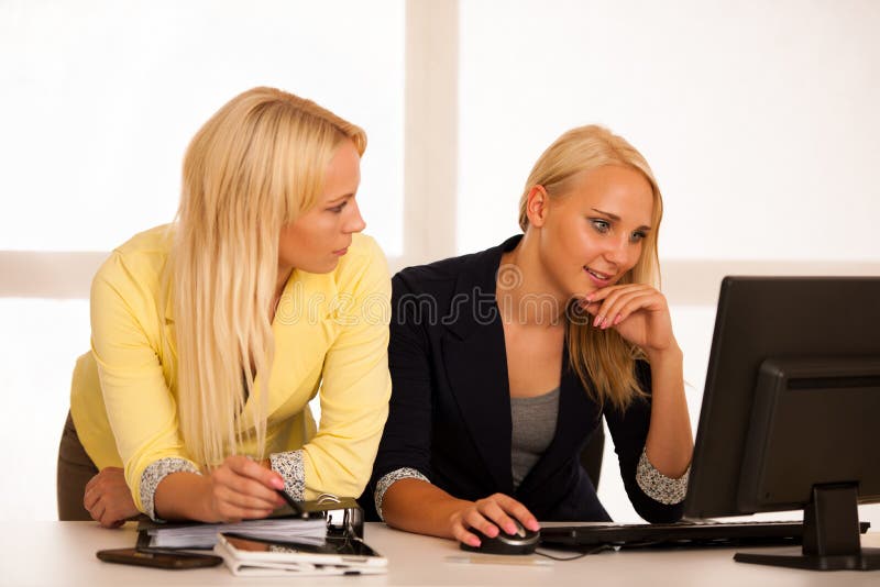 Business Team - Two Women Work in the Office Checking Database Stock ...