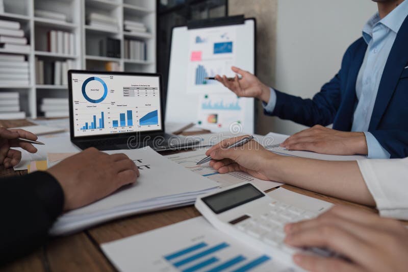 Business Team Using a Calculator To Calculate the Numbers of Statistic ...