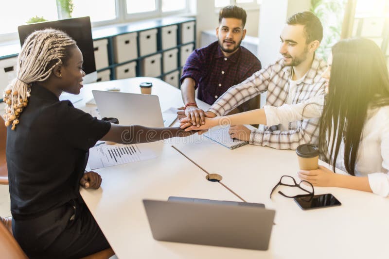 Business Team is Using Putting Hands Together and Smiling while Working ...