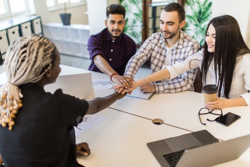 Business Team is Using Putting Hands Together and Smiling while Working ...