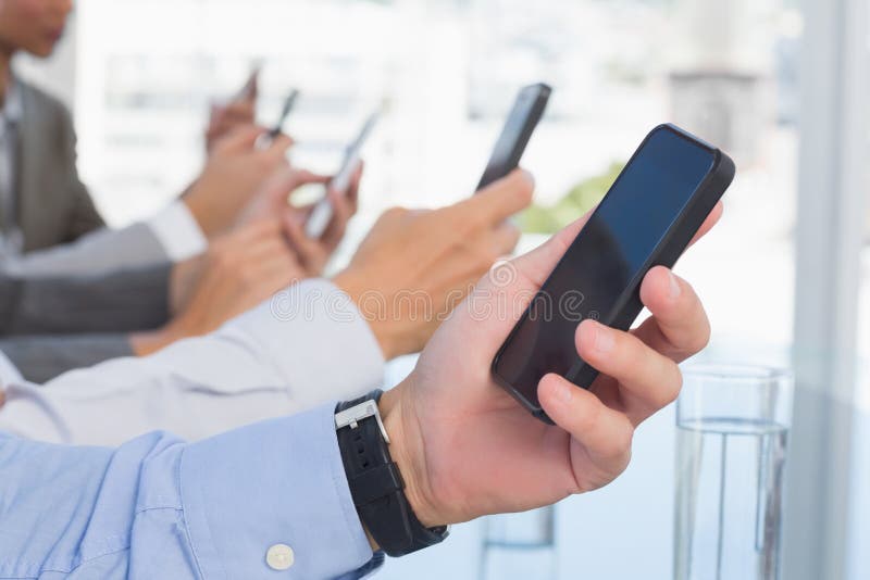 Business Team Using Their Mobile Phone Stock Photo - Image of dialing ...