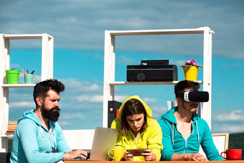Business Team Using Virtual Reality Headset and Digital Gadgets ...