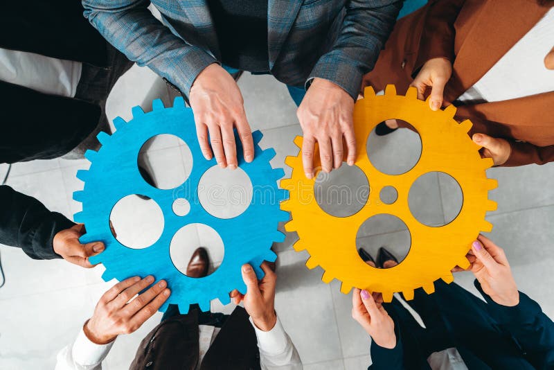 Business Team Work Together and Combine Pieces of Gears. Partnership ... Business Team Work Together and Combine Pieces of Gears. Partnership ...