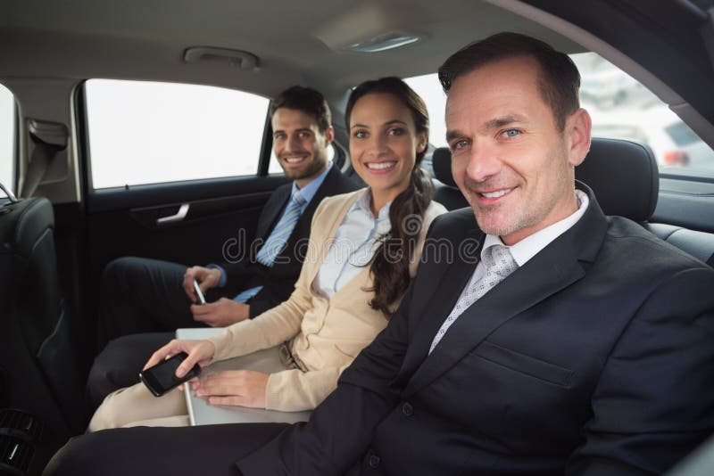 Business Team Working in the Back Seat Stock Photo - Image of adult ...