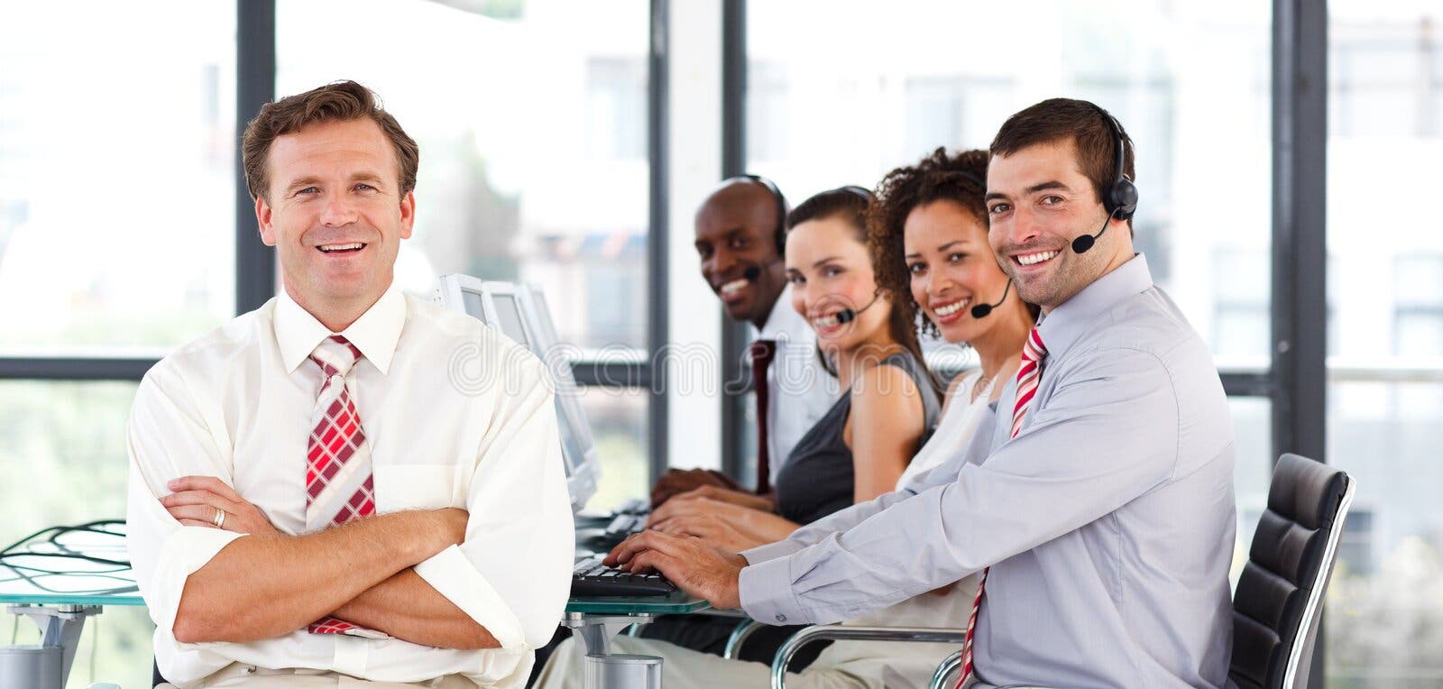 Business Team Sitting Around a Conference Table Stock Image - Image of ...