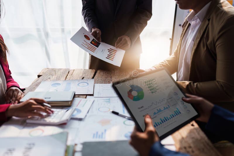 Business Team Working with Financial Document at Office. Analysis ...