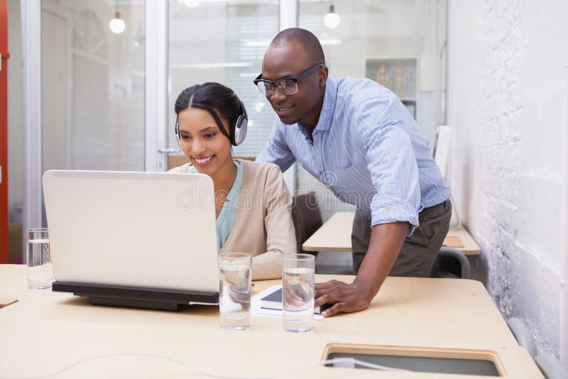 Business Team Working Happily Together on Laptop Stock Photo - Image of ...
