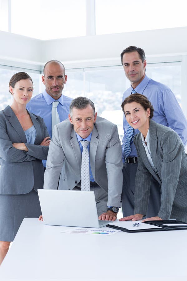 Business Team Working Happily Together on Laptop Stock Photo - Image of ...