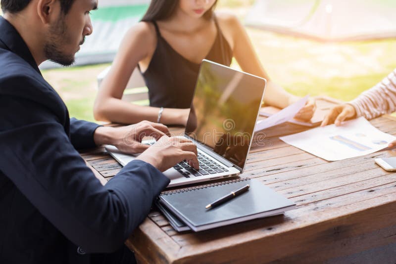 Business Team Working on Laptop, while Sitting at Office. Business ...