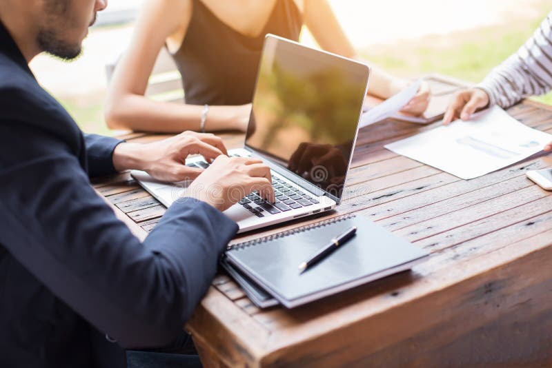 Business Team Working on Laptop, while Sitting at Office. Business ...