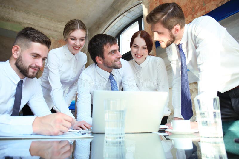 Business Team Working on Laptop To Check the Results of Their Work ...