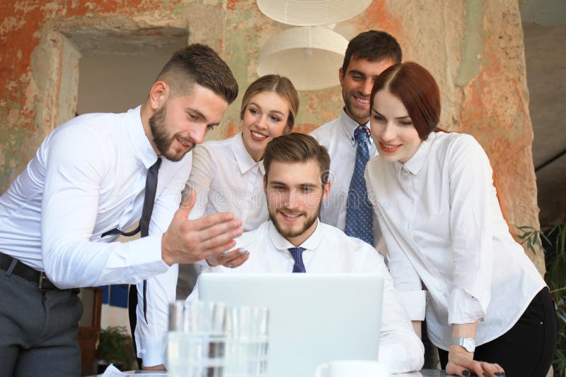 Business Team Working on Laptop To Check the Results of Their Work ...