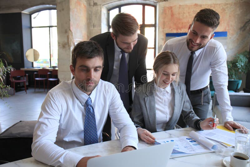 Business Team Working on Laptop To Check the Results of Their Work ...