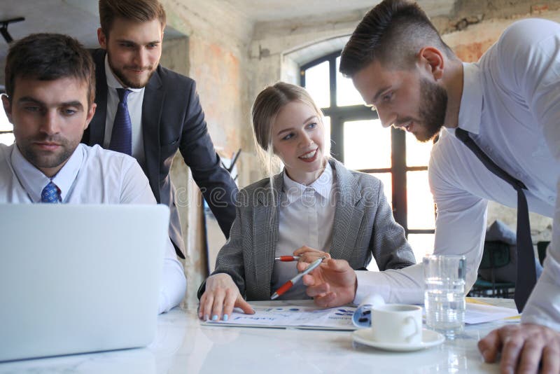 Business Team Working on Laptop To Check the Results of Their Work ...