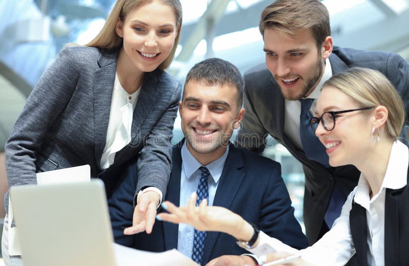 Business Team Working on Laptop To Check the Results of Their Work ...