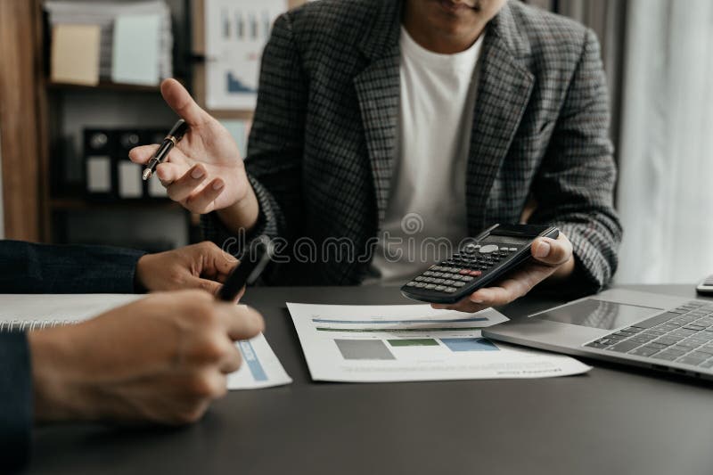 Business Team Working and Studying Together with Tablet Document Graph ...