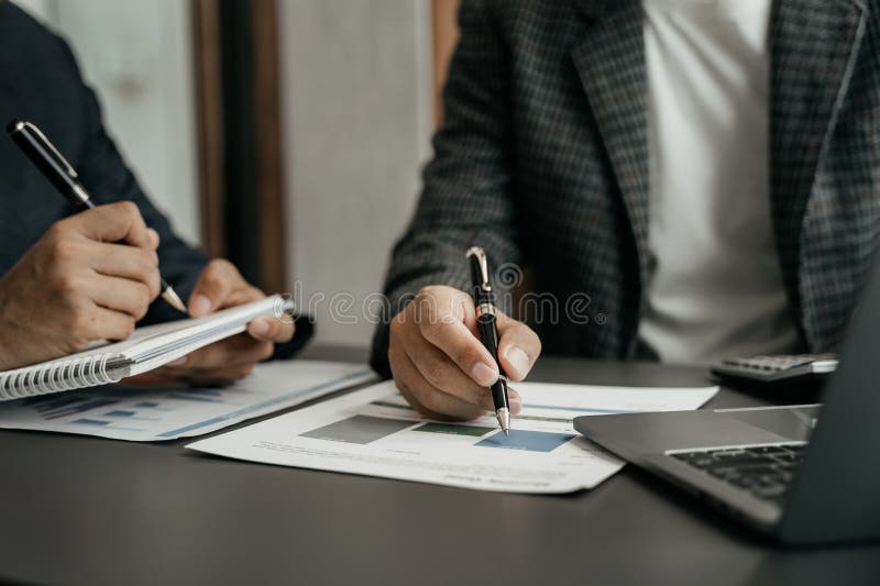 Business Team Working and Studying Together with Tablet Document Graph ...