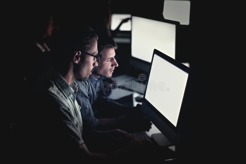Business Team Works on Computers at Night. Stock Image - Image of ...
