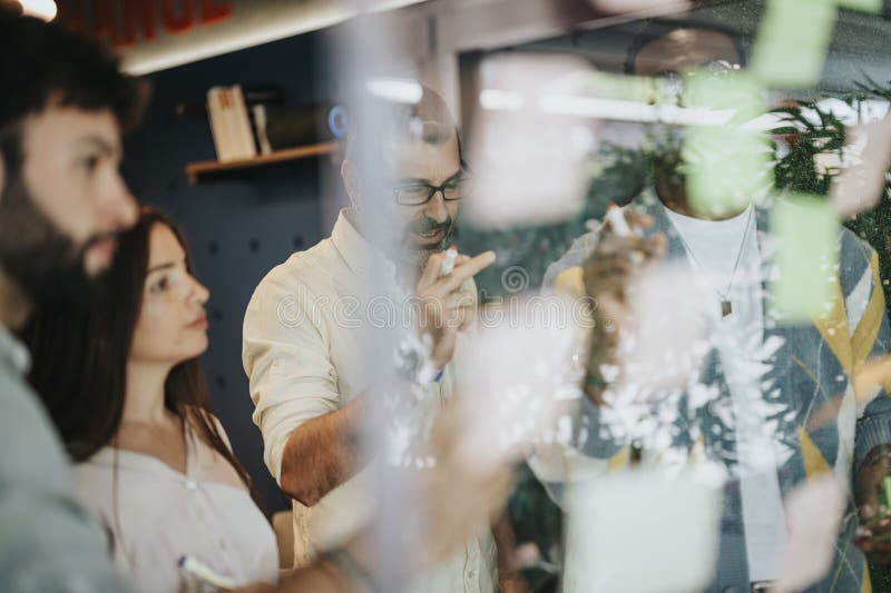 Business Team Write Ideas on Sticky Notes, Sharing Knowledge and ...