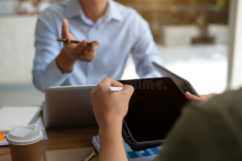 Business Team Write Project Ideas and Use Tablet and Laptops To Edit ...