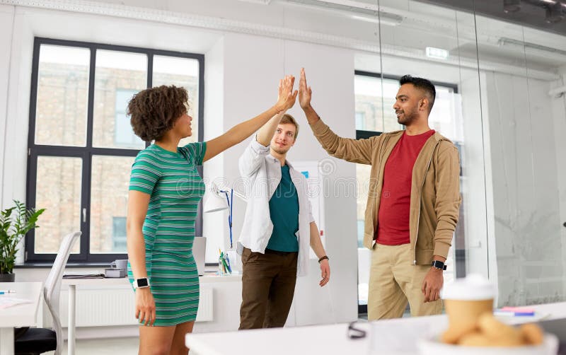 Happy Creative Team Making High Five at Office Stock Photo - Image of ...