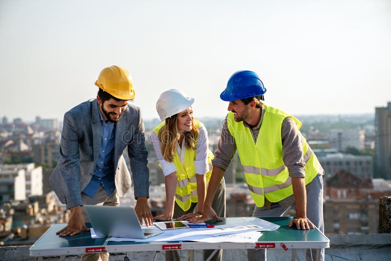 Business, Teamwork and People Concept. Group of Engineers and ...