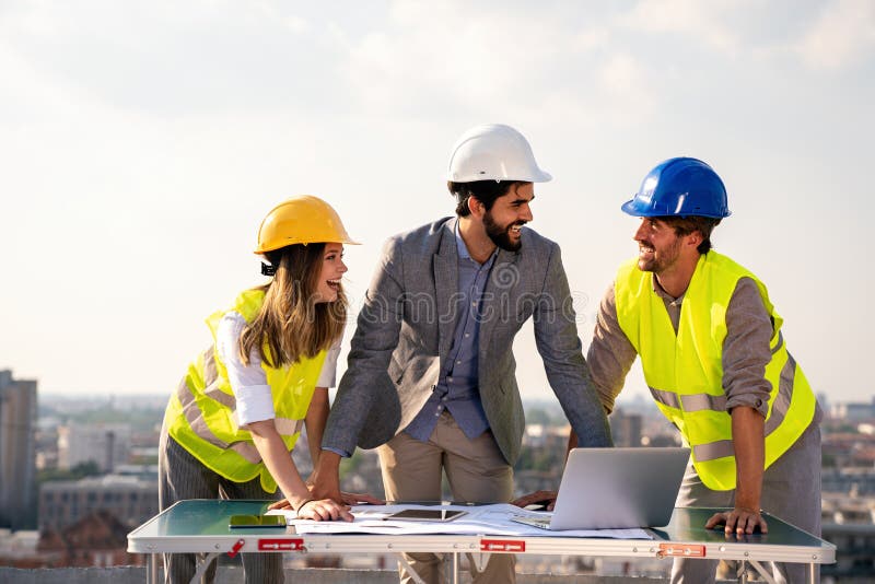 Business, Teamwork and People Concept. Group of Engineers and ...