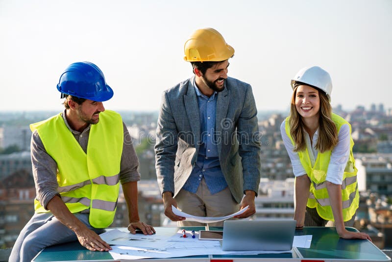 Business, Teamwork and People Concept. Group of Engineers and ...