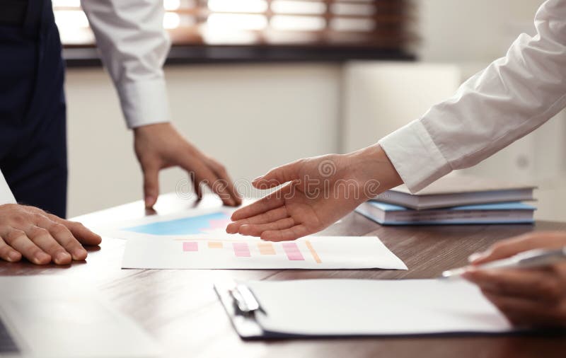 Business Trainer and Client Working at Table in Office Stock Photo ...