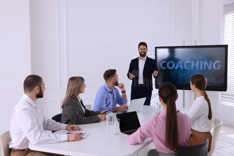 Business Trainer Near Interactive Board in Meeting Room during ...
