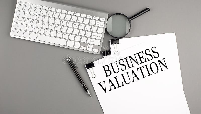 BUSINESS VALUATION Text on Paper with Keyboard, Magnifier and Pen ...