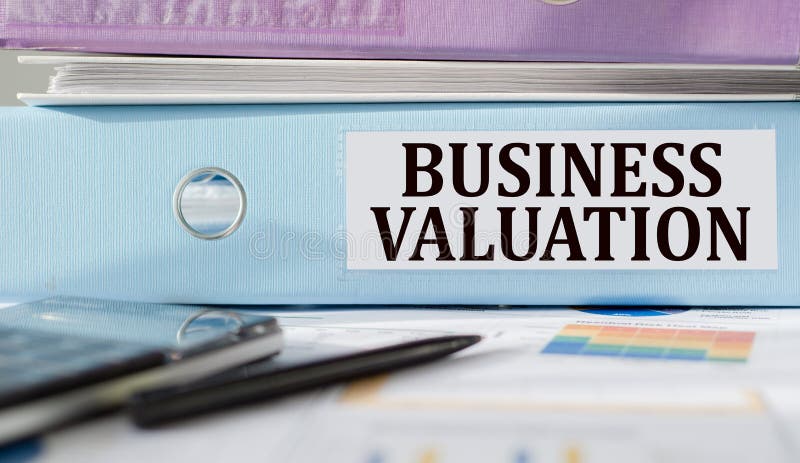 BUSINESS VALUATION Text Written on Folder with Documents and Calculator ...
