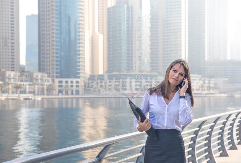 Business Woman Accepting a Phone Call. Stock Photo - Image of boardwalk ...
