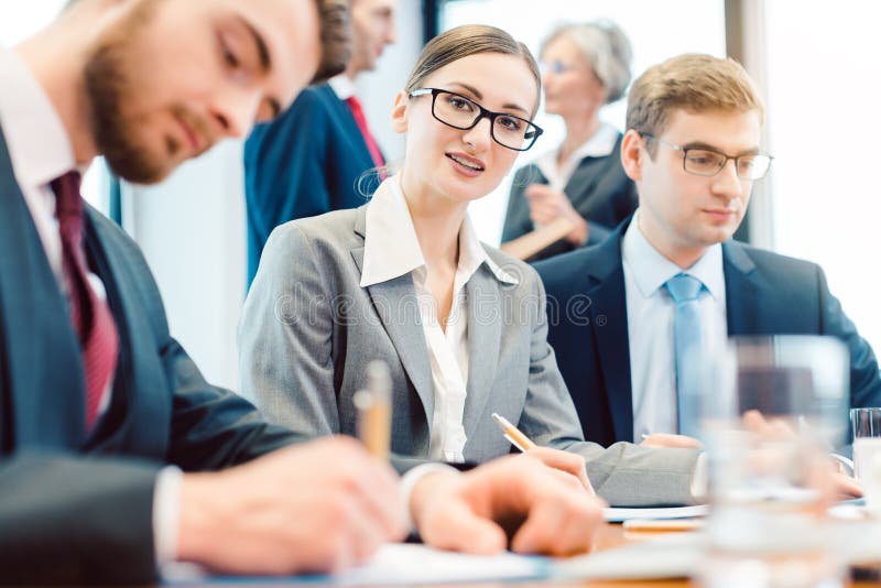 Business Woman Amidst Team Working in Office Stock Image - Image of ...