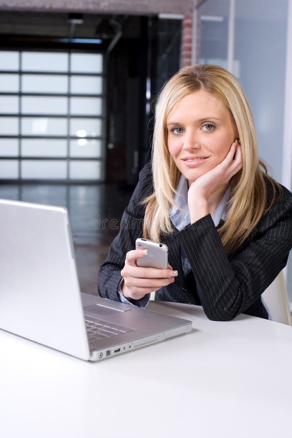 Business Woman on Cell at Desk Stock Photo - Image of office, looking ...