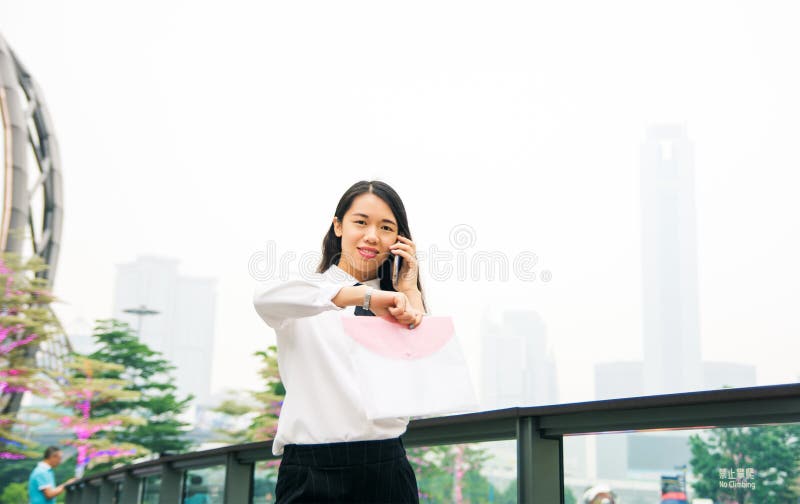 Business Woman Checking Time while Using Phone Stock Photo - Image of ...