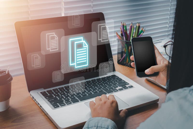 Business Woman Hand Using Laptop Computer and Smart Phone with Document ...