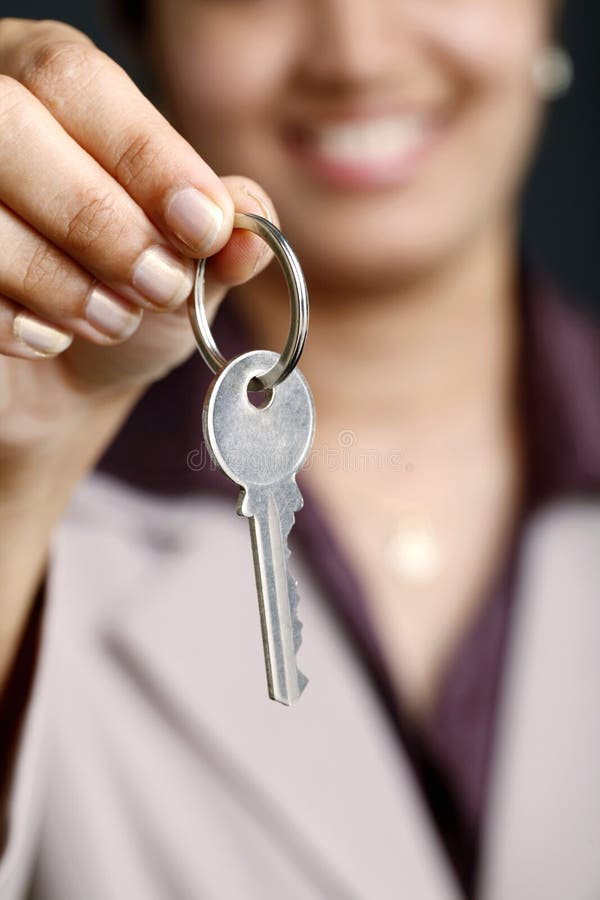 Business woman holding key stock image. Image of buyer - 25075825