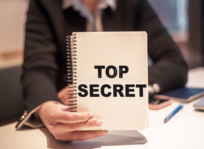 Business Woman Holds a Notebook with the Text TOP SECRET Stock Image ...